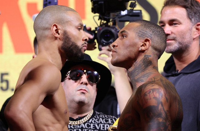 Who was the man in sunglasses in between Eubank Jr and Benn?